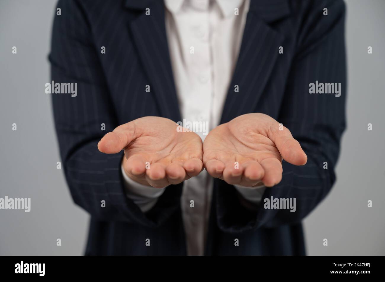 Close-up of caucasian woman holding her palms up Stock Photo - Alamy