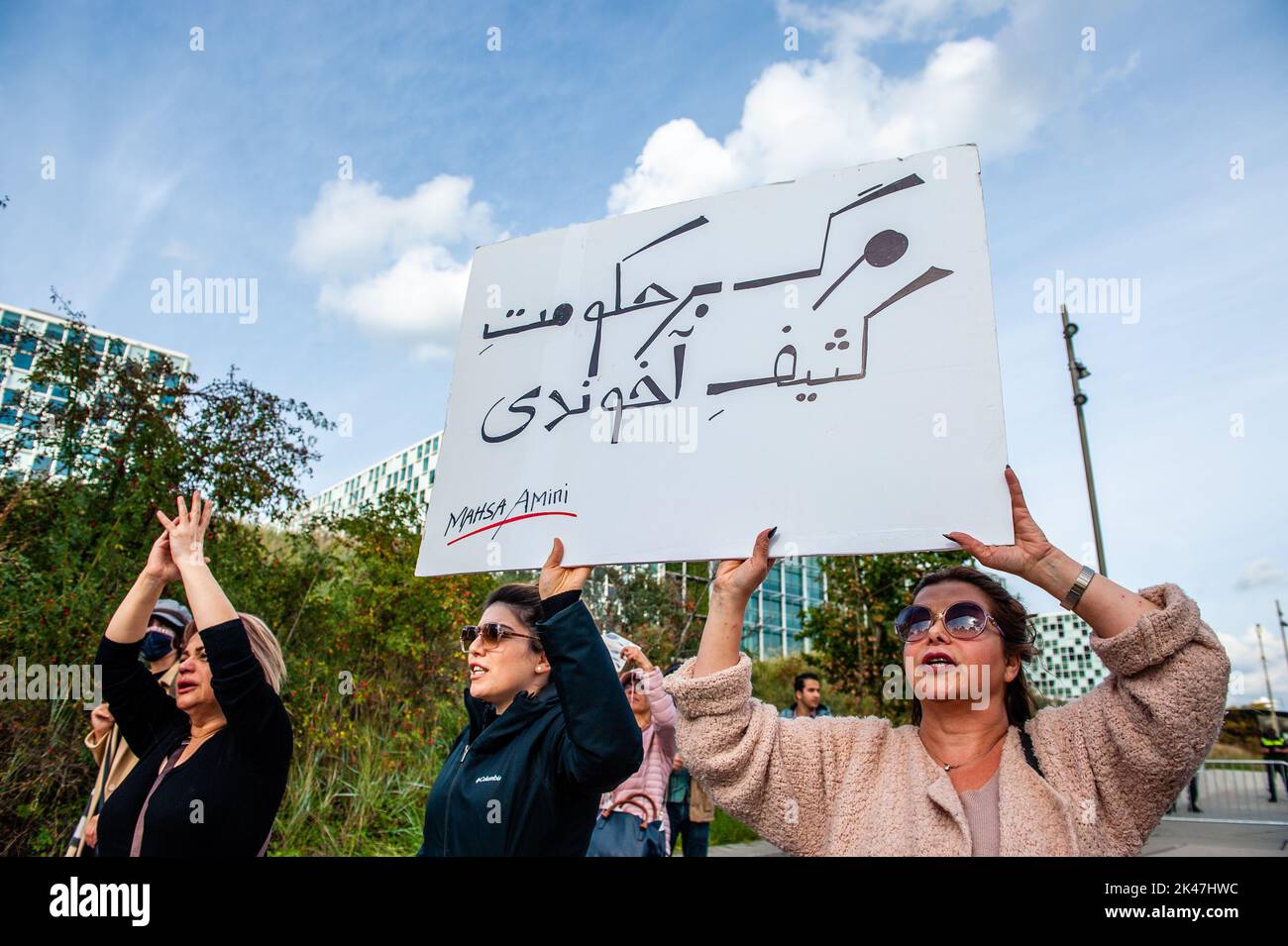 The Hague, Netherlands. 30th Sep, 2022. Iranian women are seen holding ...