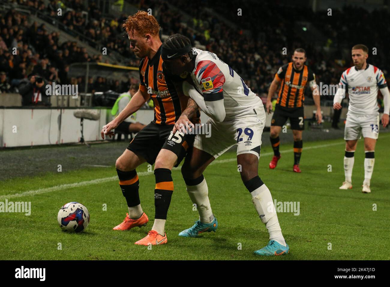 Ryan Woods #15 of Hull City shields the ball from Amari’i Bell #29 ...