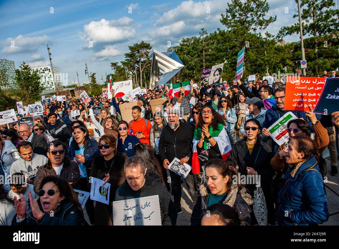 Thousands of Iranian protesters are seen shouting slogans against the ...