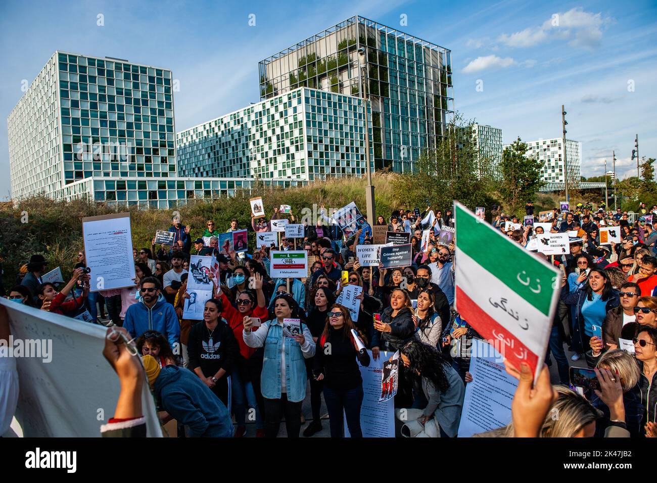 Iranian people are seen gathering in front of the ICC building while ...
