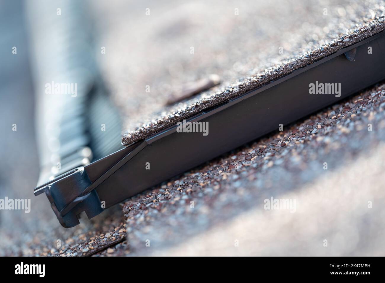 Ridge cap vent installed on a shingle roof for passive attic ...