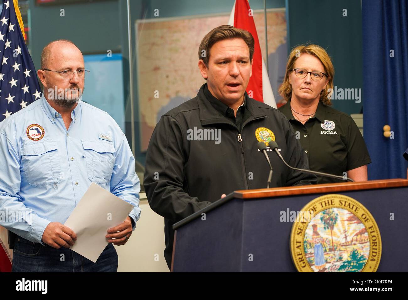 Tallahassee, USA. 30th Sep, 2022. Florida Governor Ron DeSantis, center ...