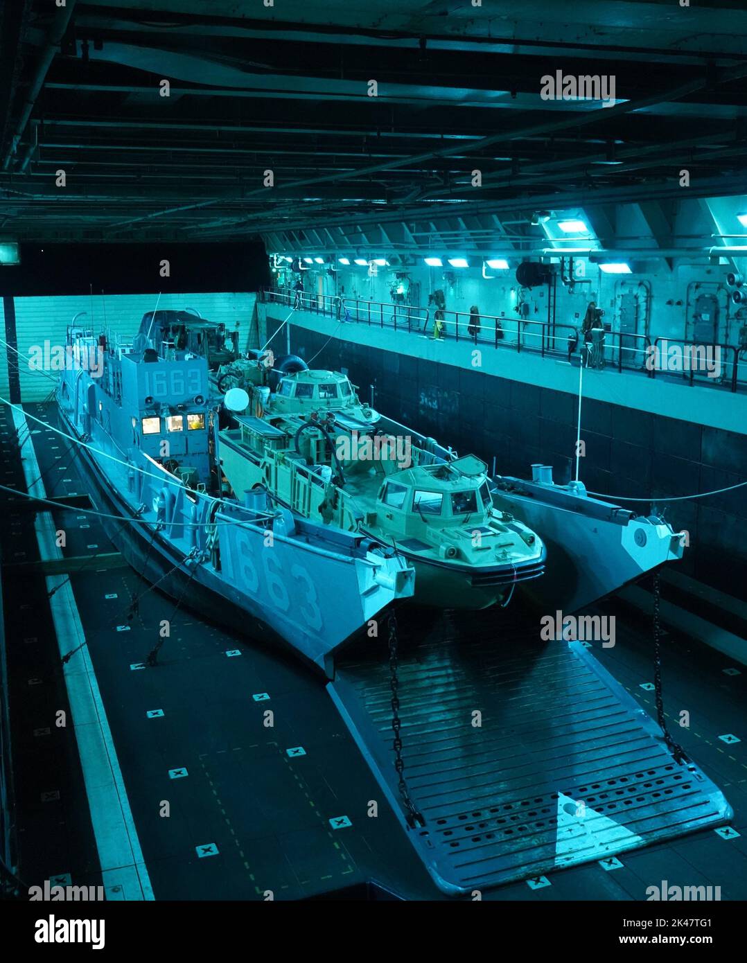 Landing Craft, Utility 1663 sits loaded, staged, and ready in the well ...