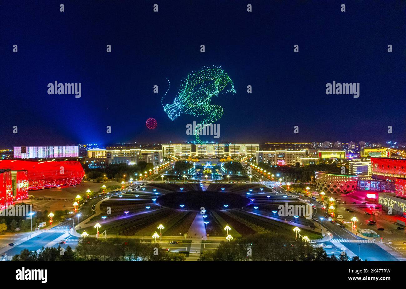 ORDOS, CHINA - SEPTEMBER 30, 2022 - A cluster of drones performs a ...