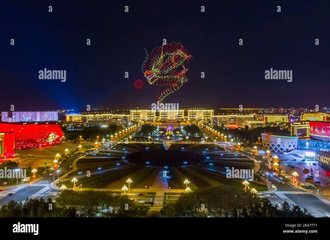 ORDOS, CHINA - SEPTEMBER 30, 2022 - A cluster of drones performs a ...