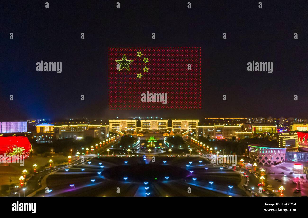 ORDOS, CHINA - SEPTEMBER 30, 2022 - A cluster of drones performs a ...