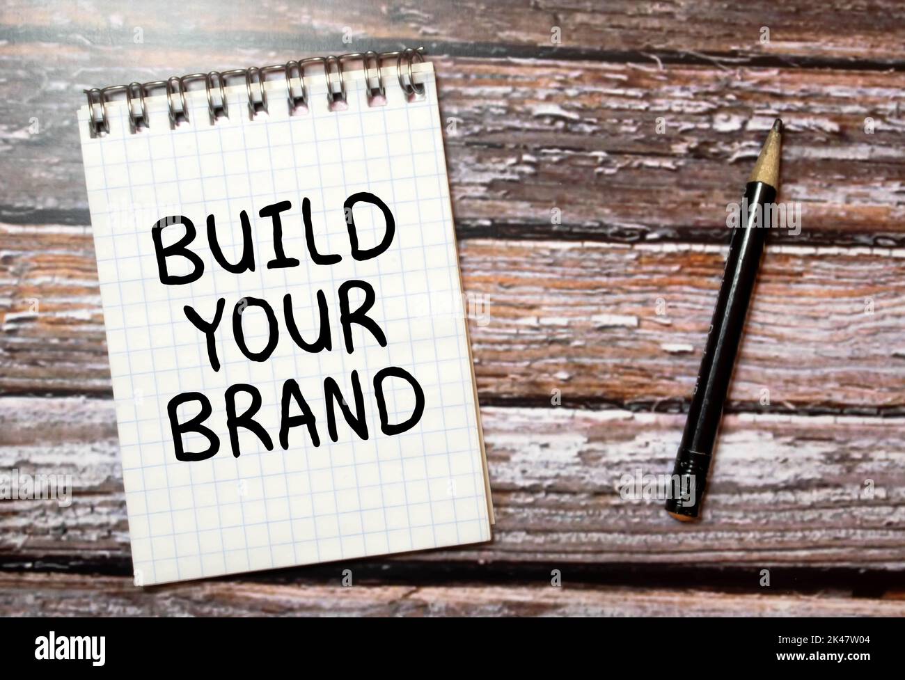 conceptual image, word BUILD YOUR BRAND on white canvas frame and ... conceptual image, word BUILD YOUR BRAND on white canvas frame and ...