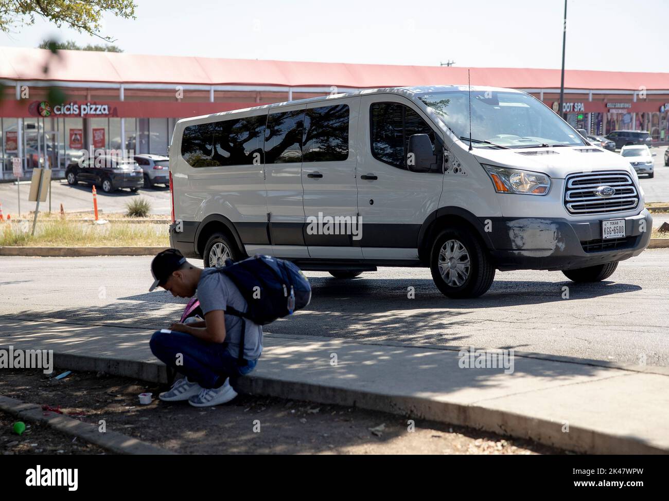 San Antonio, USA. 30th Sep, 2022. A van transports migrants from a ...