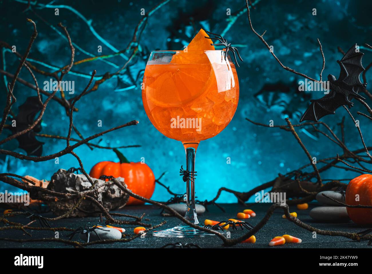 Halloween aperol spritz cocktail on scary dark blue background with ...