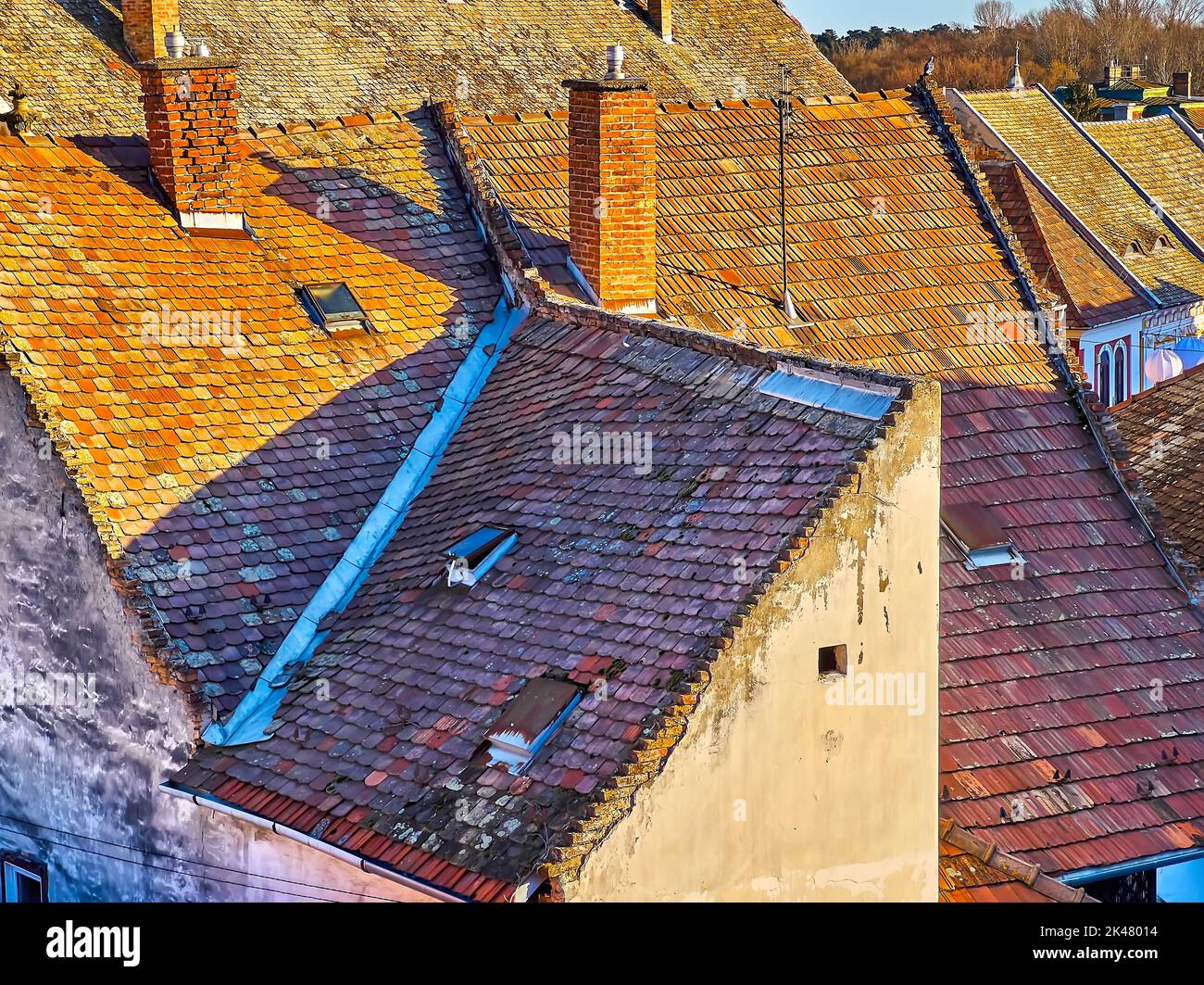 The old shabby reddish tile roof of the house in Szentendre, Hungary ...