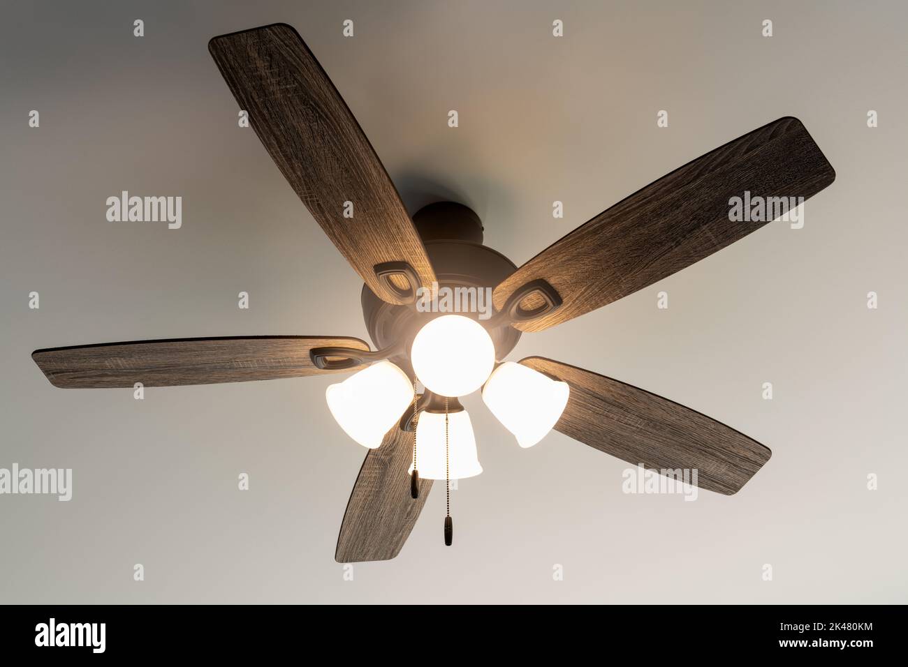 Residential ceiling fan in motion on a white ceiling Stock Photo - Alamy