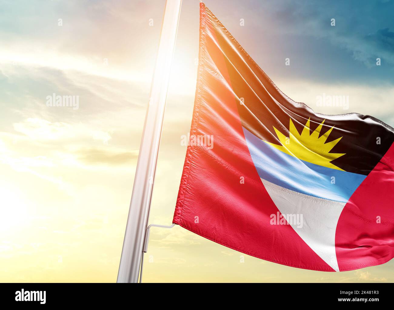 Antigua and Barbuda national flag waving in beautiful sky Stock Photo ...