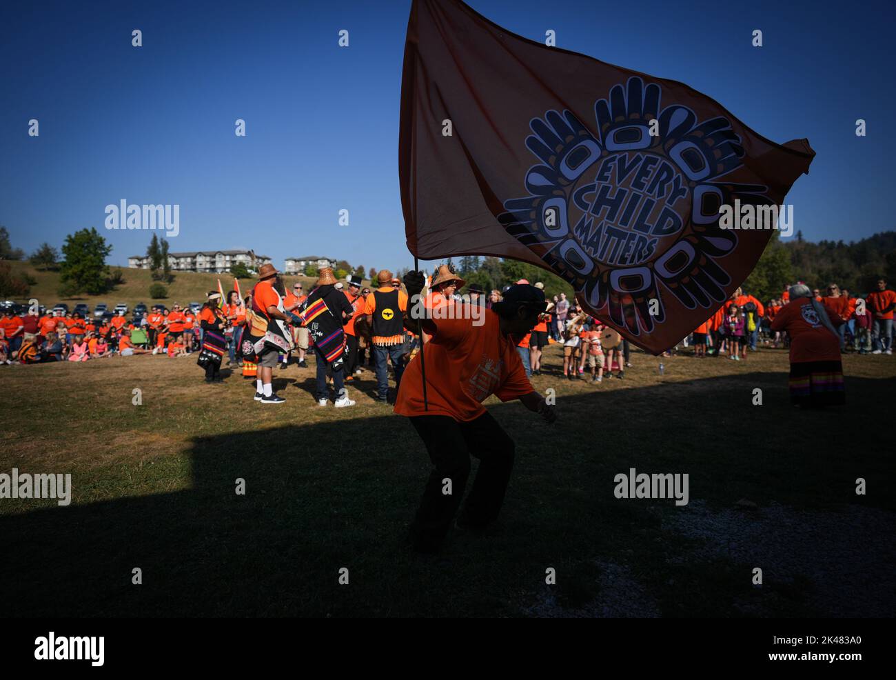 Canada. 30th Sep, 2022. A man waves an Every Child Matters flag as ...