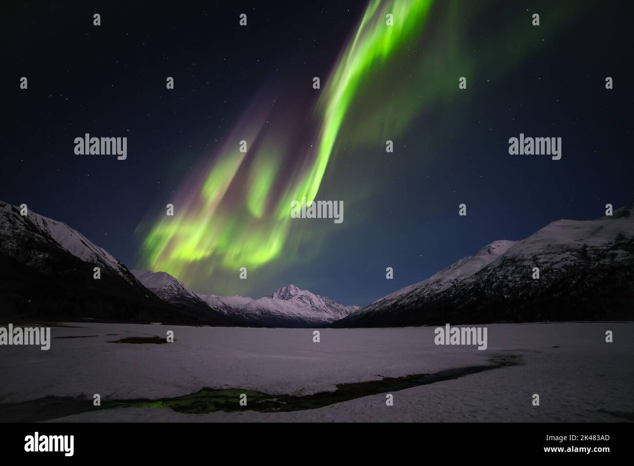 northern lights across mountain landscape Stock Photo - Alamy