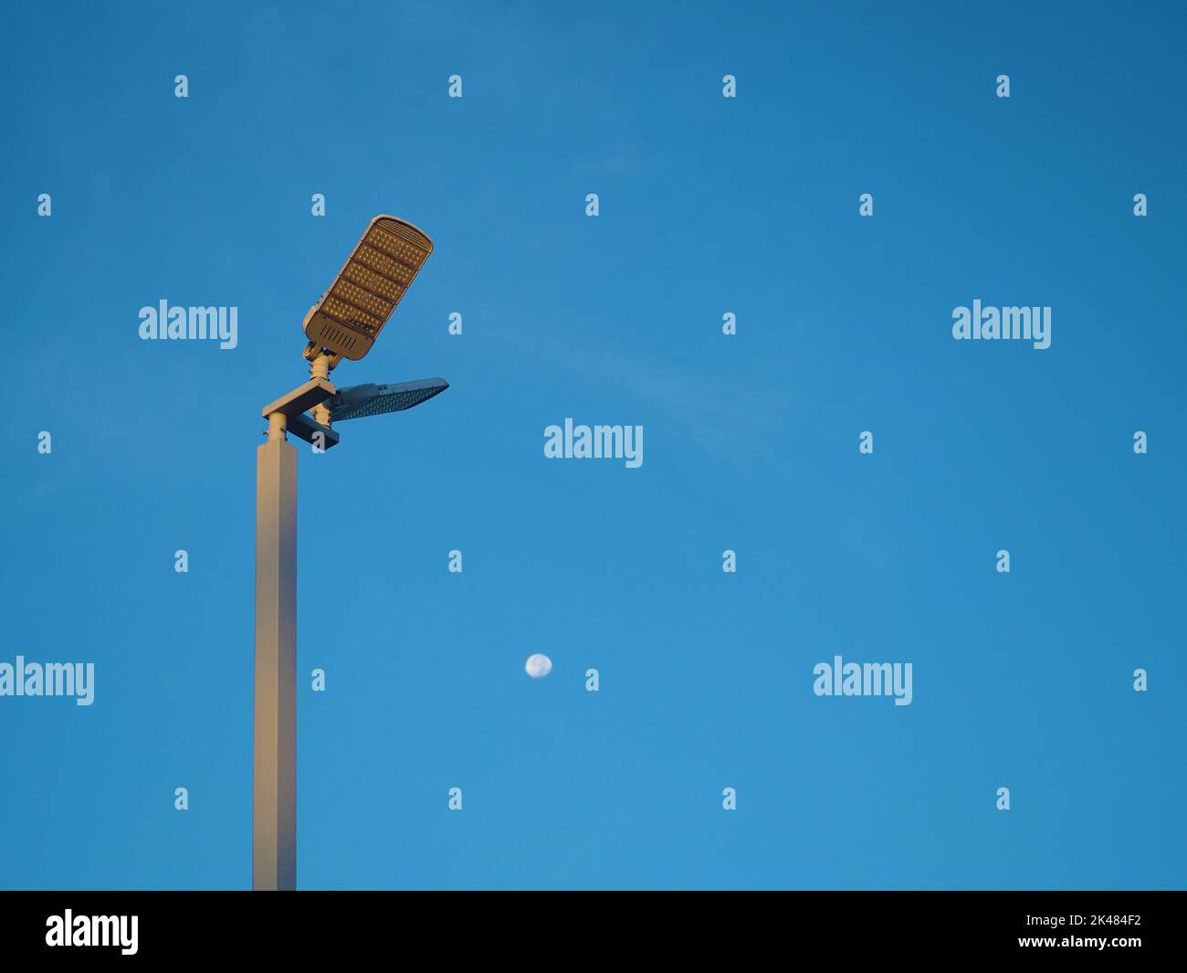 The spotlight tower on the background is a blue sky And there is a ...