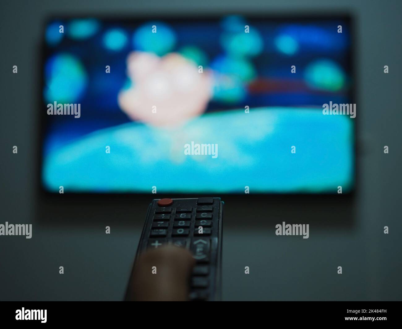 The remote control image on the TV background is out of focus Stock ...