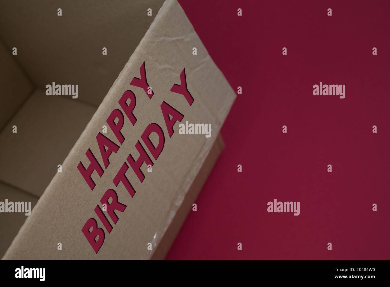 Happy Birthday word with cardboard box. Brown folded card box Stock ...