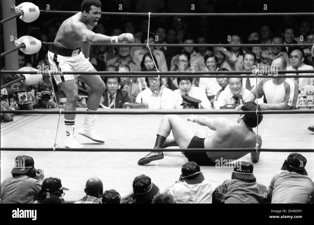 File photo shows Japanese wrestler Antonio Inoki (R) taking on world ...