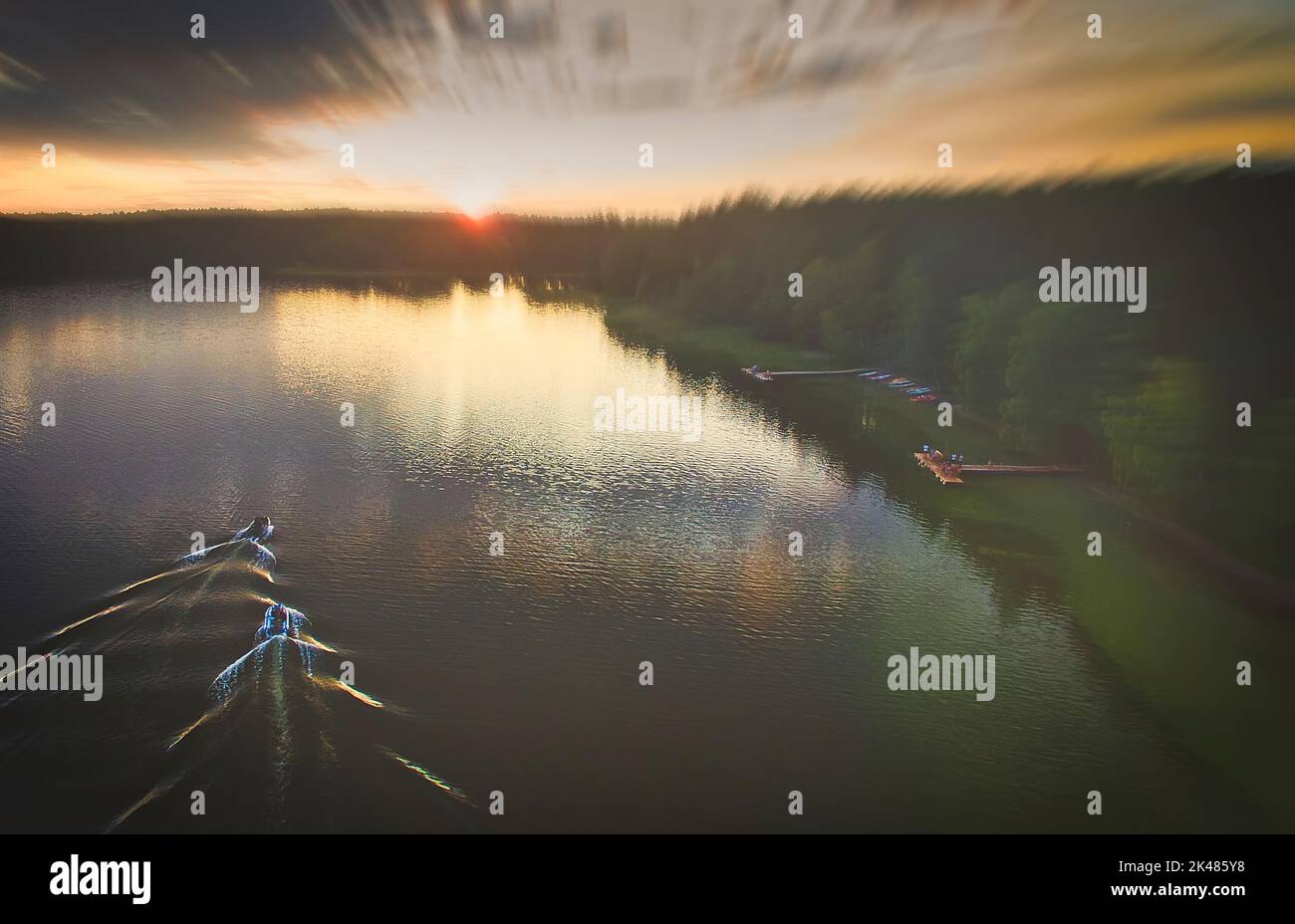 Aerial top down view of lake Baltieji Lakajai coast with boats and ...
