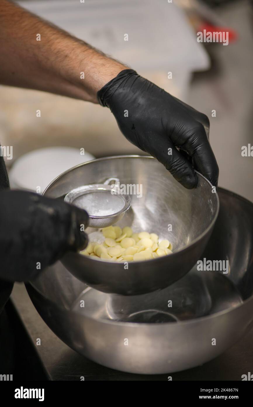 White chocolate ganache drip hi-res stock photography and images - Alamy