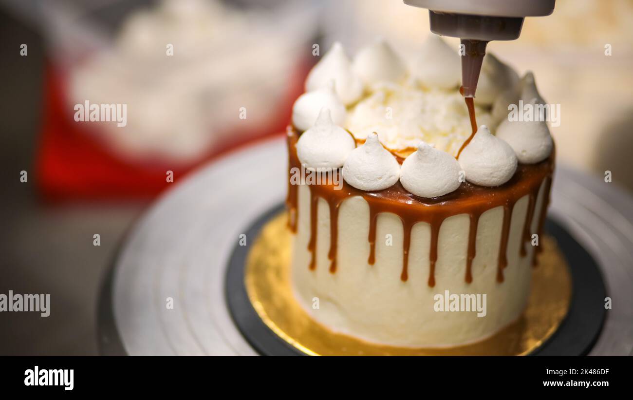 Chef decorating cake caramel cream hi-res stock photography and images ...
