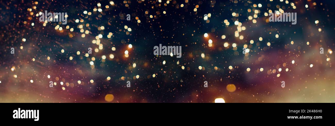 Abstract light celebration background with defocused golden lights for ...