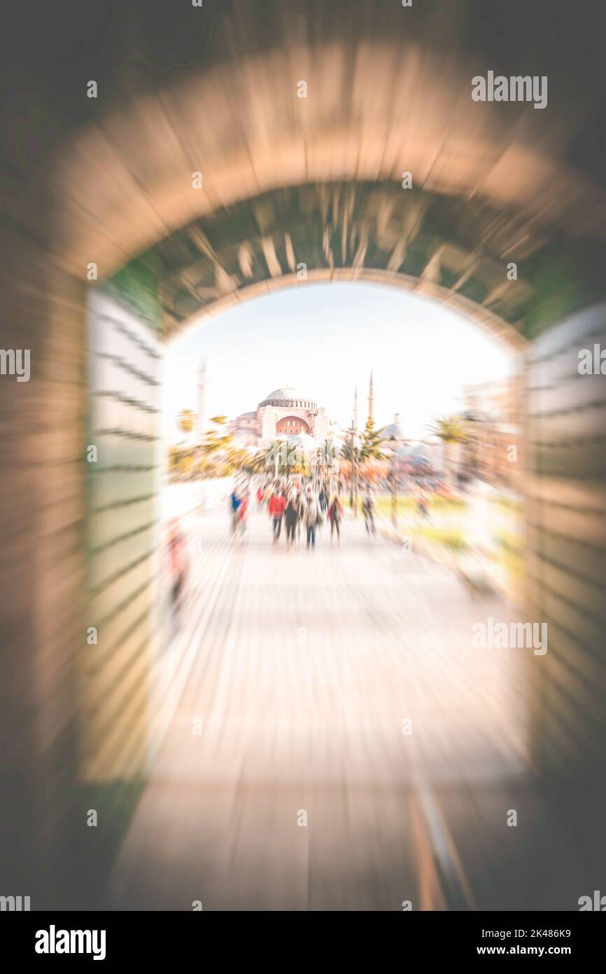 Tourists walk be entrance gates down the path towards national museum ...