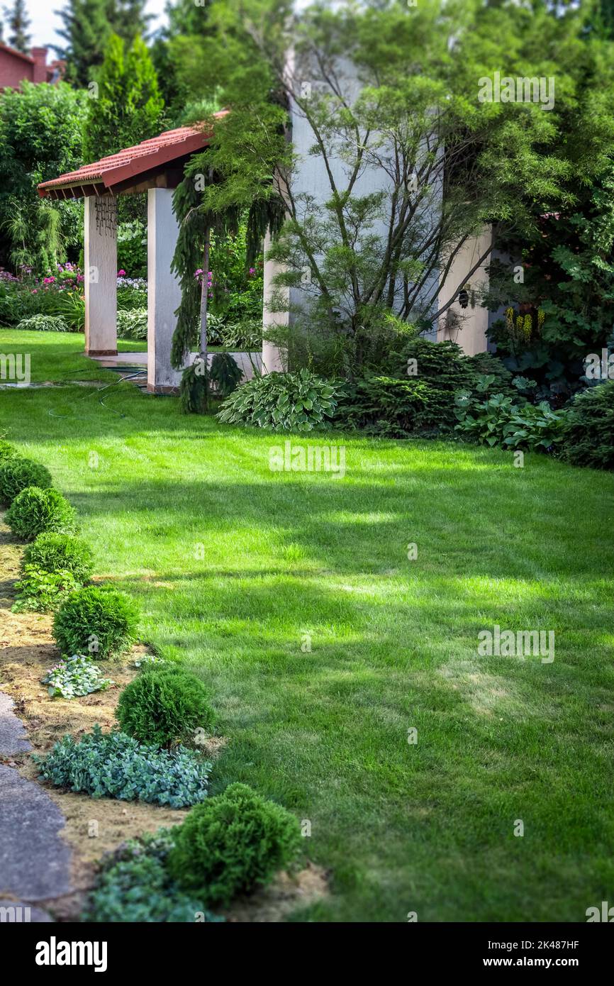 Backyard design elements of a beautiful private house Stock Photo - Alamy