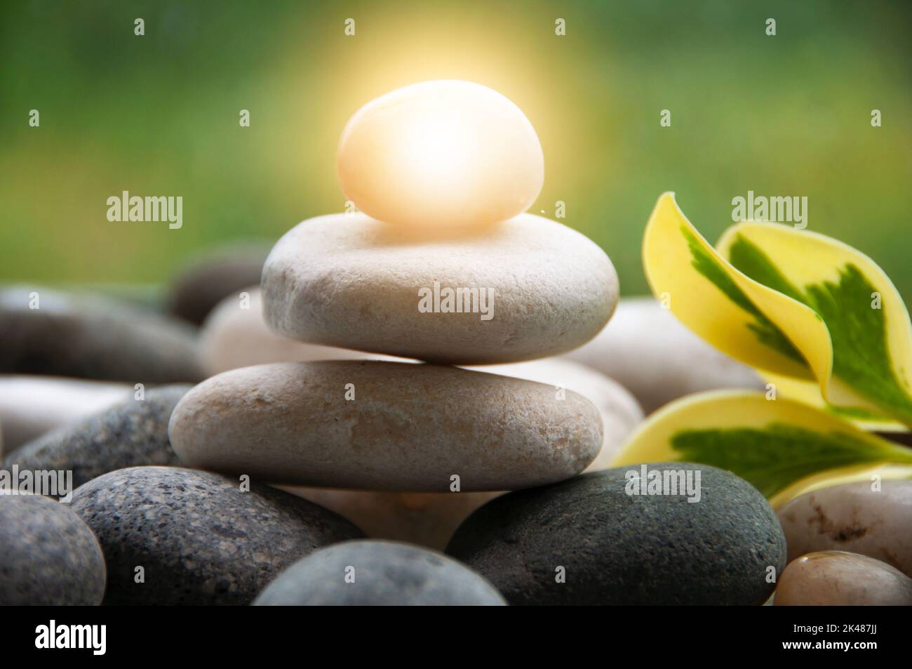 Light shining on zen stone with customizable space for text. Copy space ...