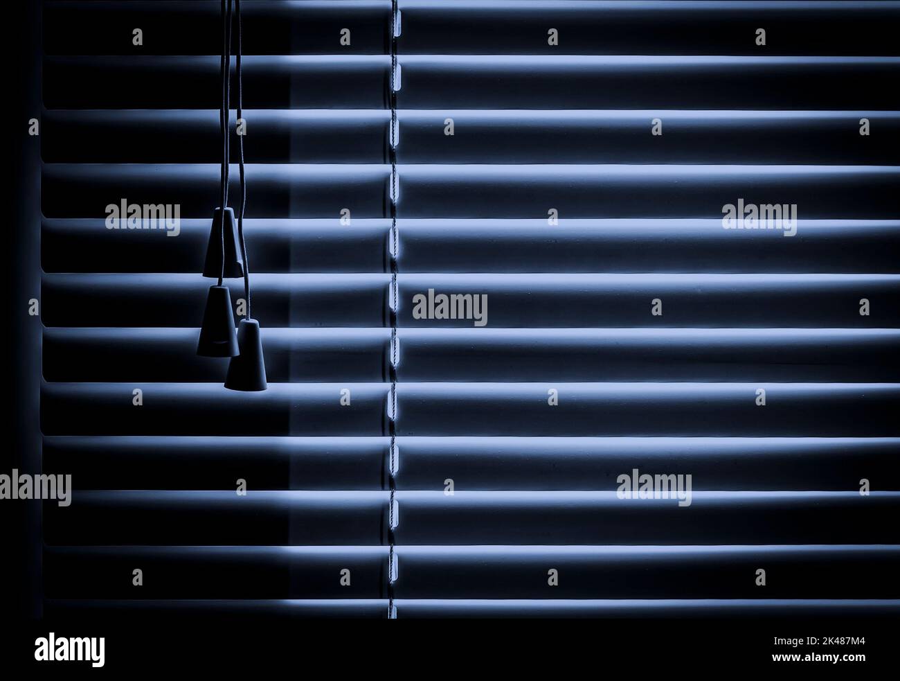 Aluminum horizontal blinds close-up against the backdrop of moonlight ...