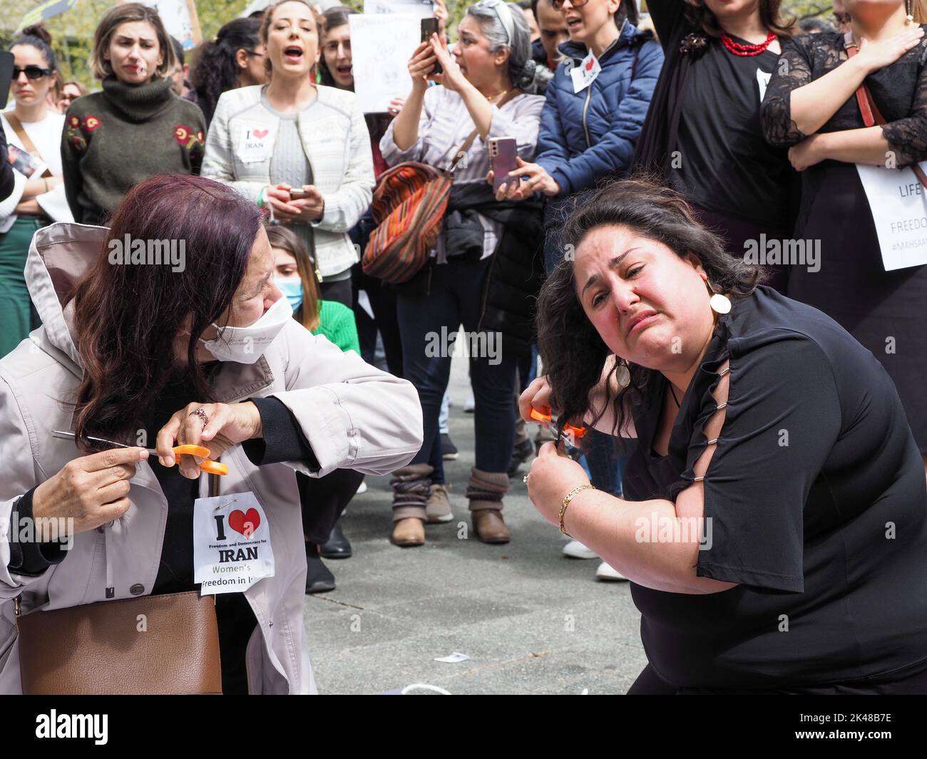 Cutting hair in protest hi-res stock photography and images - Alamy