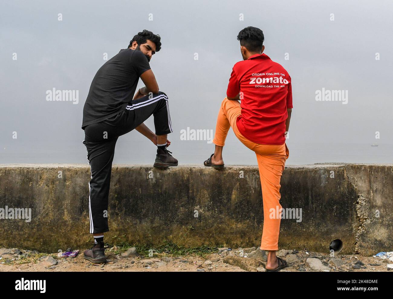 Mumbai, India. 01st Oct, 2022. A Zomato delivery man is seen standing ...