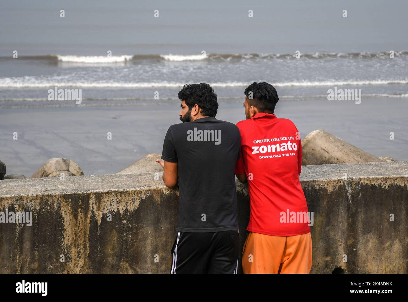 Mumbai, India. 01st Oct, 2022. A Zomato delivery man is seen standing ...