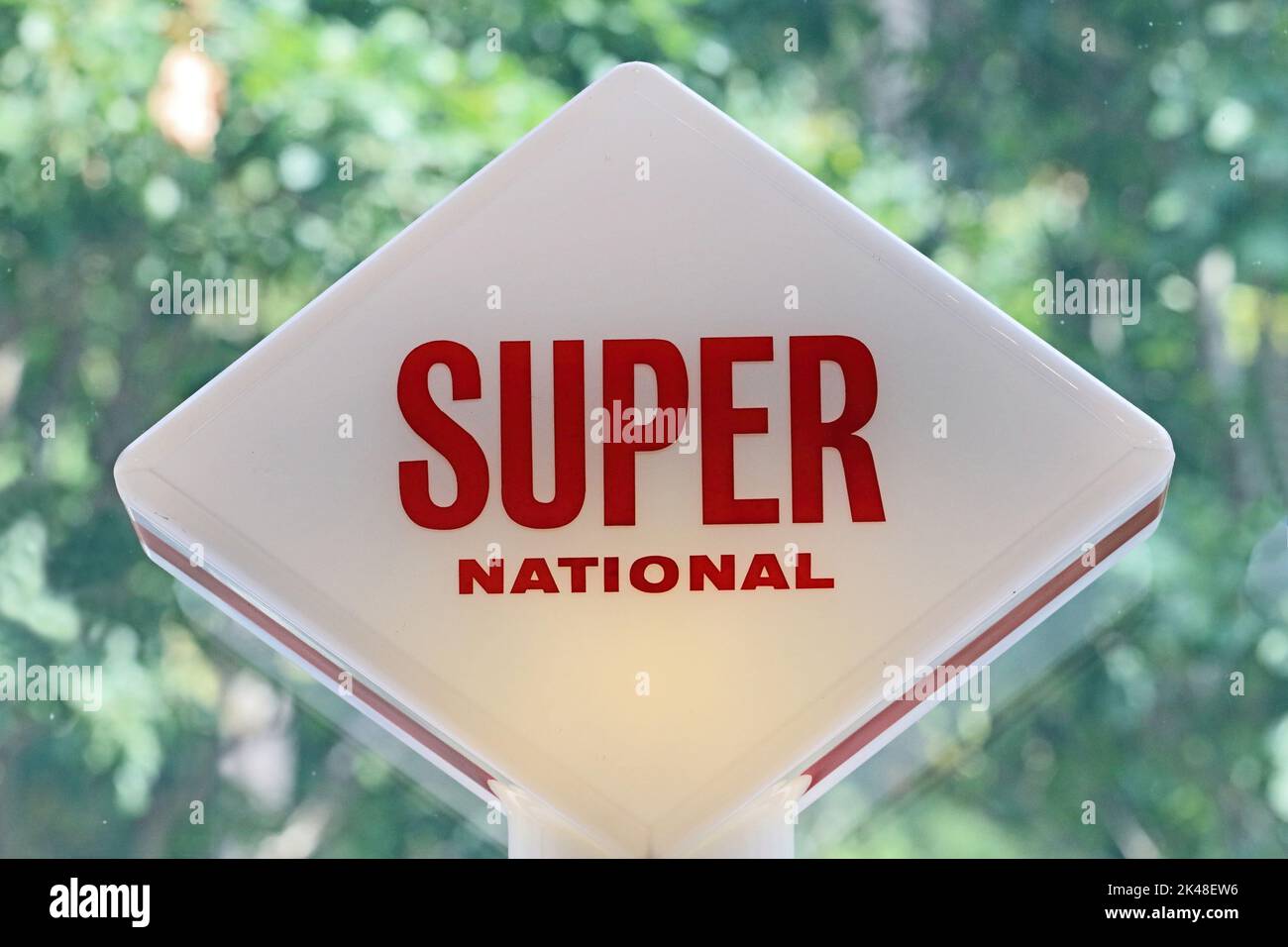 Illuminated, old, National Super petrol pump sign Stock Photo - Alamy