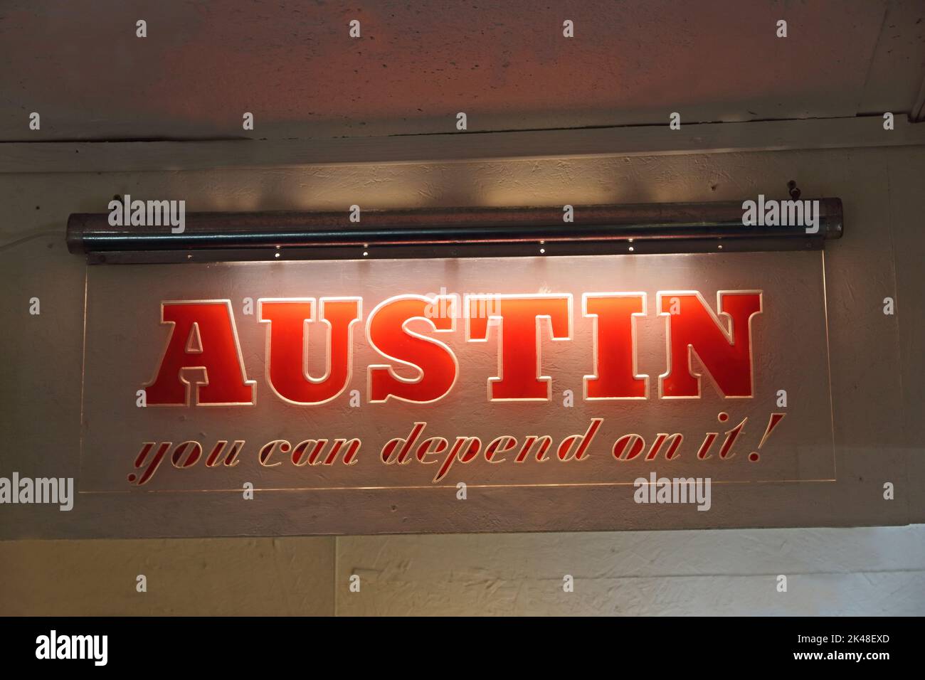 Old, illuminated Austin advertising sign used in car sales garage Stock ...