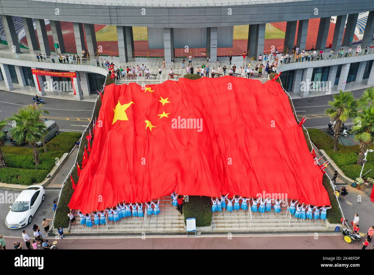 GUILIN, CHINA - OCTOBER 1, 2022 - Thousands of cheongsam fans perform ...