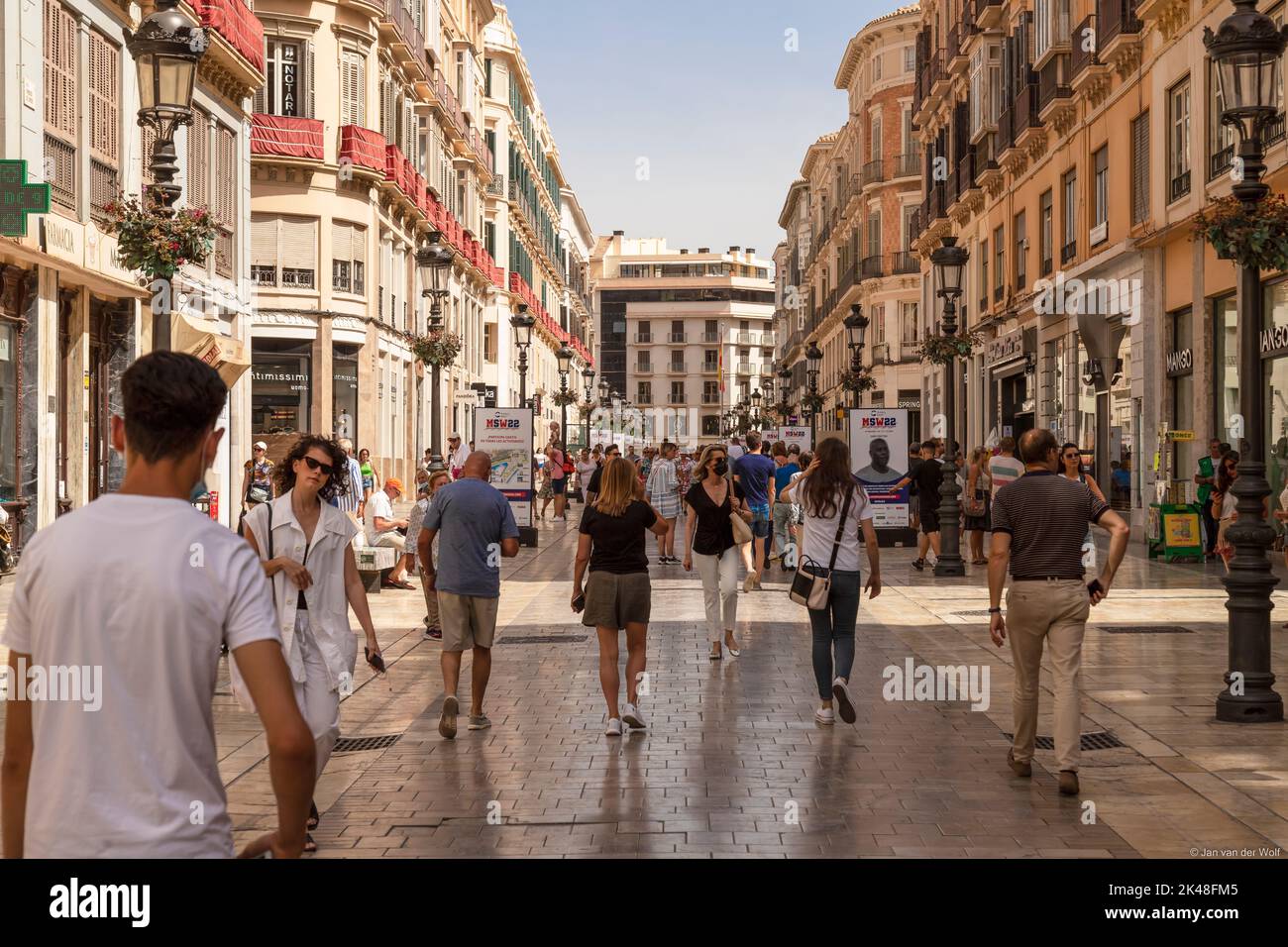 Pedestrians in a busy popular shopping street in the old town of the ...