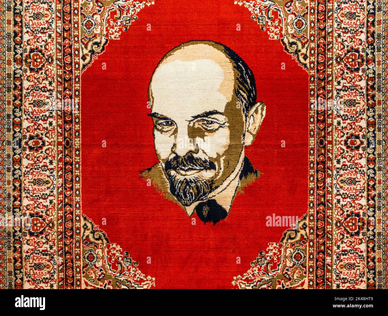 Lenin portrait on the carpet in the Grutas park. Druskininkai ...