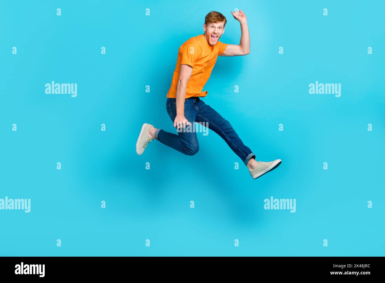 Full size photo of hooray red hair guy jump wear t-shirt jeans boots ...