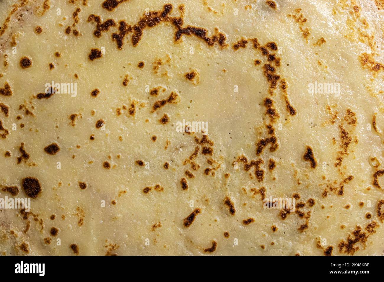 Pancake surface texture and pattern. Close-up of thin hot pancakes in a ...