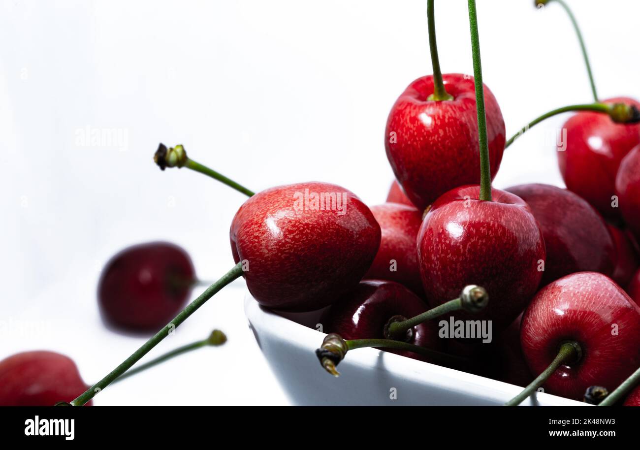 Cherries in close-up. Red fruit with green petioles. The structure of ...