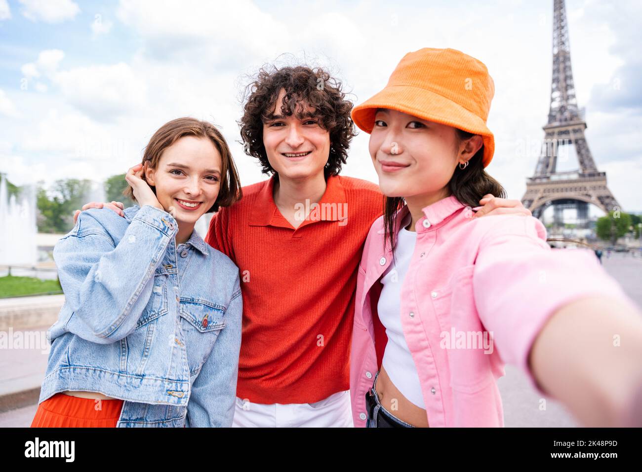 Group of young happy friends visiting Paris and Eiffel Tower, Trocadero ...
