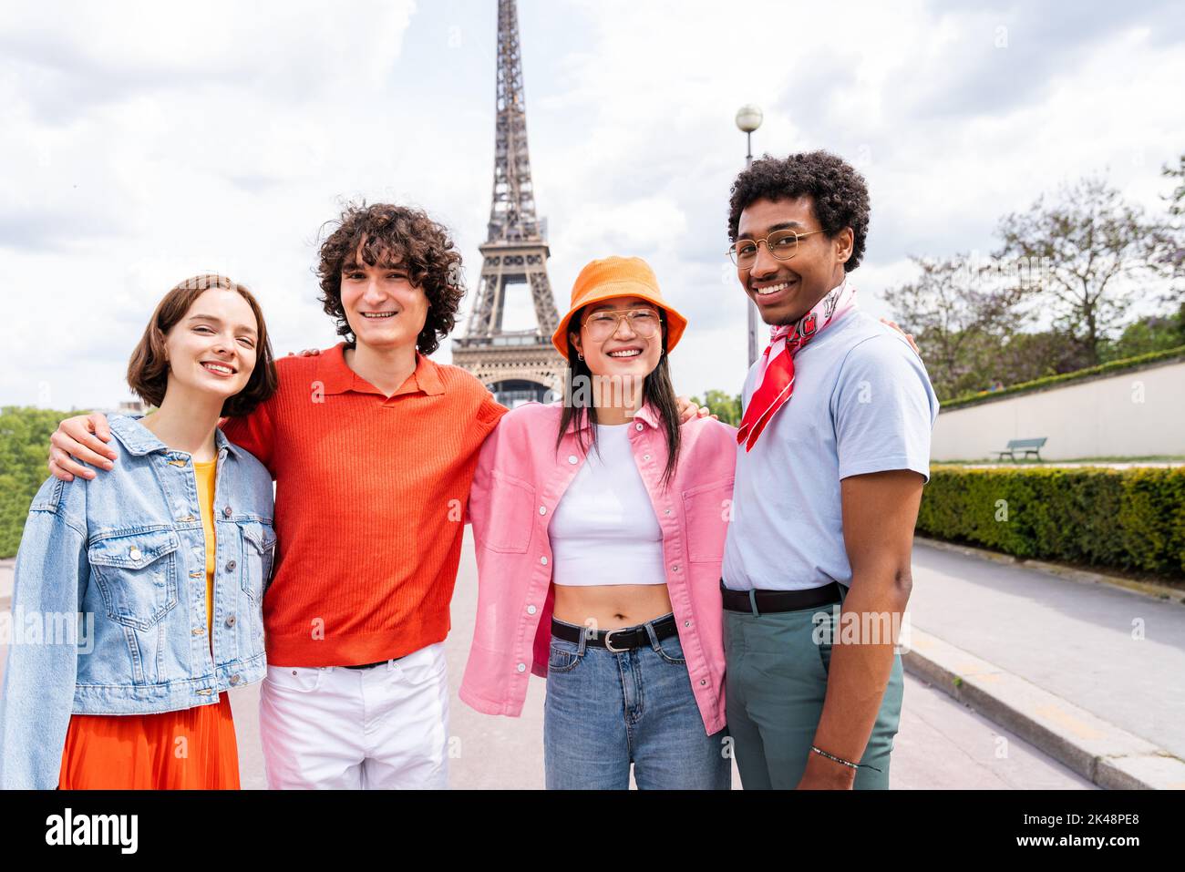 Group of young happy friends visiting Paris and Eiffel Tower, Trocadero ...
