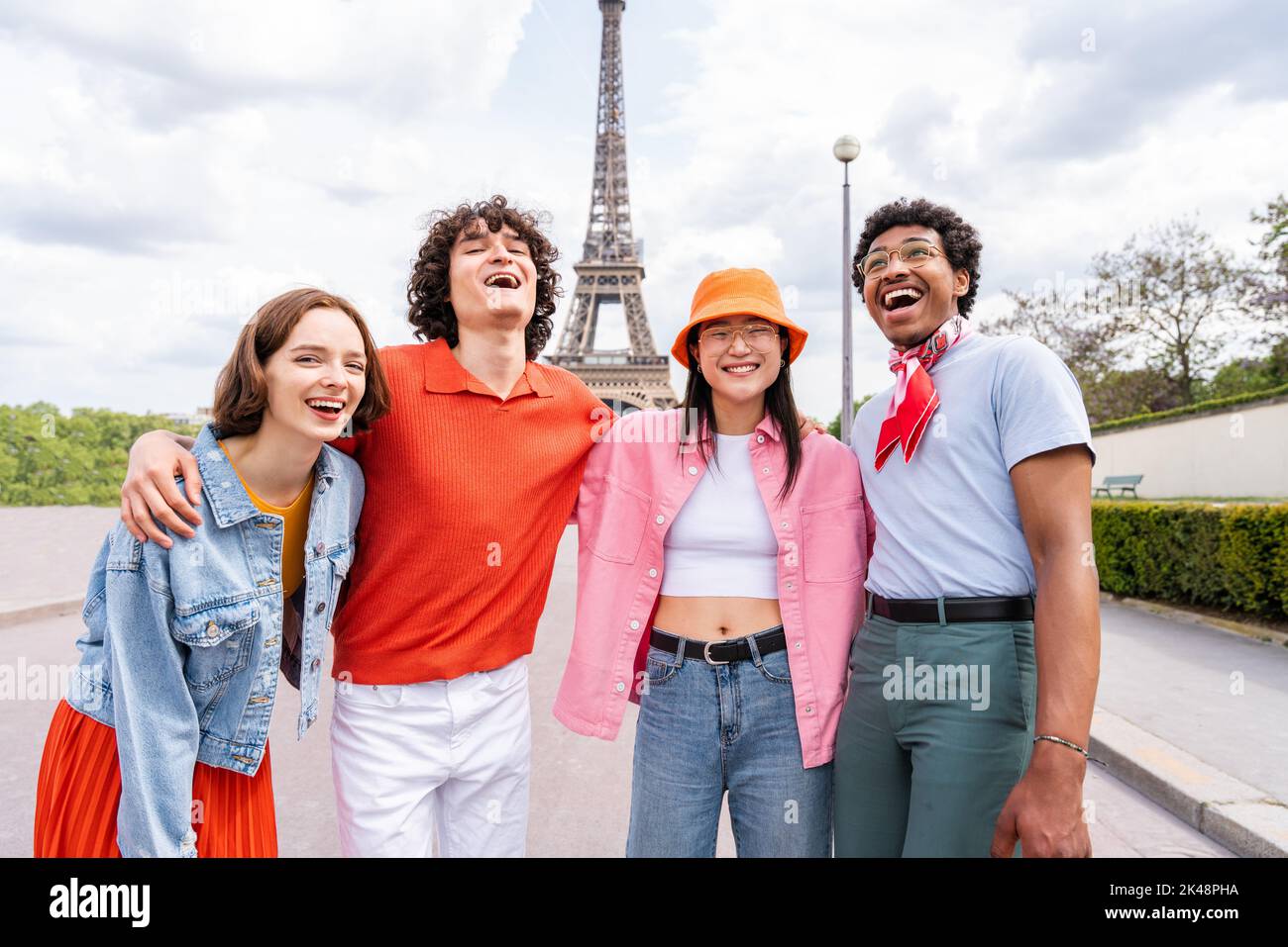 Group of young happy friends visiting Paris and Eiffel Tower, Trocadero ...