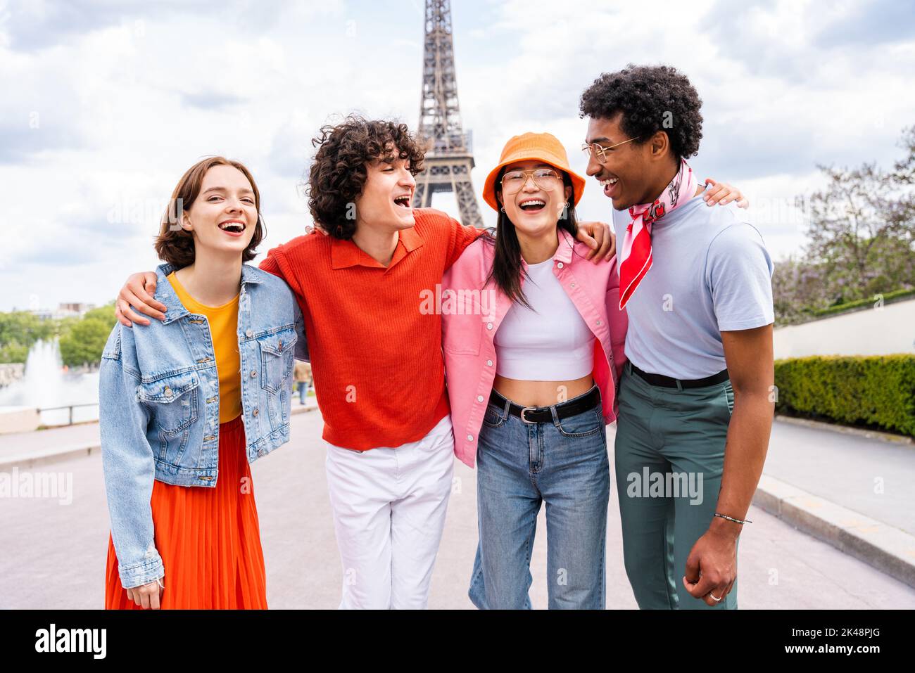 Group of young happy friends visiting Paris and Eiffel Tower, Trocadero ...