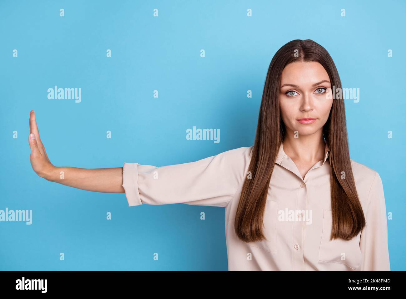 Photo of nice upset young girl stretch hand showing aside decline ...