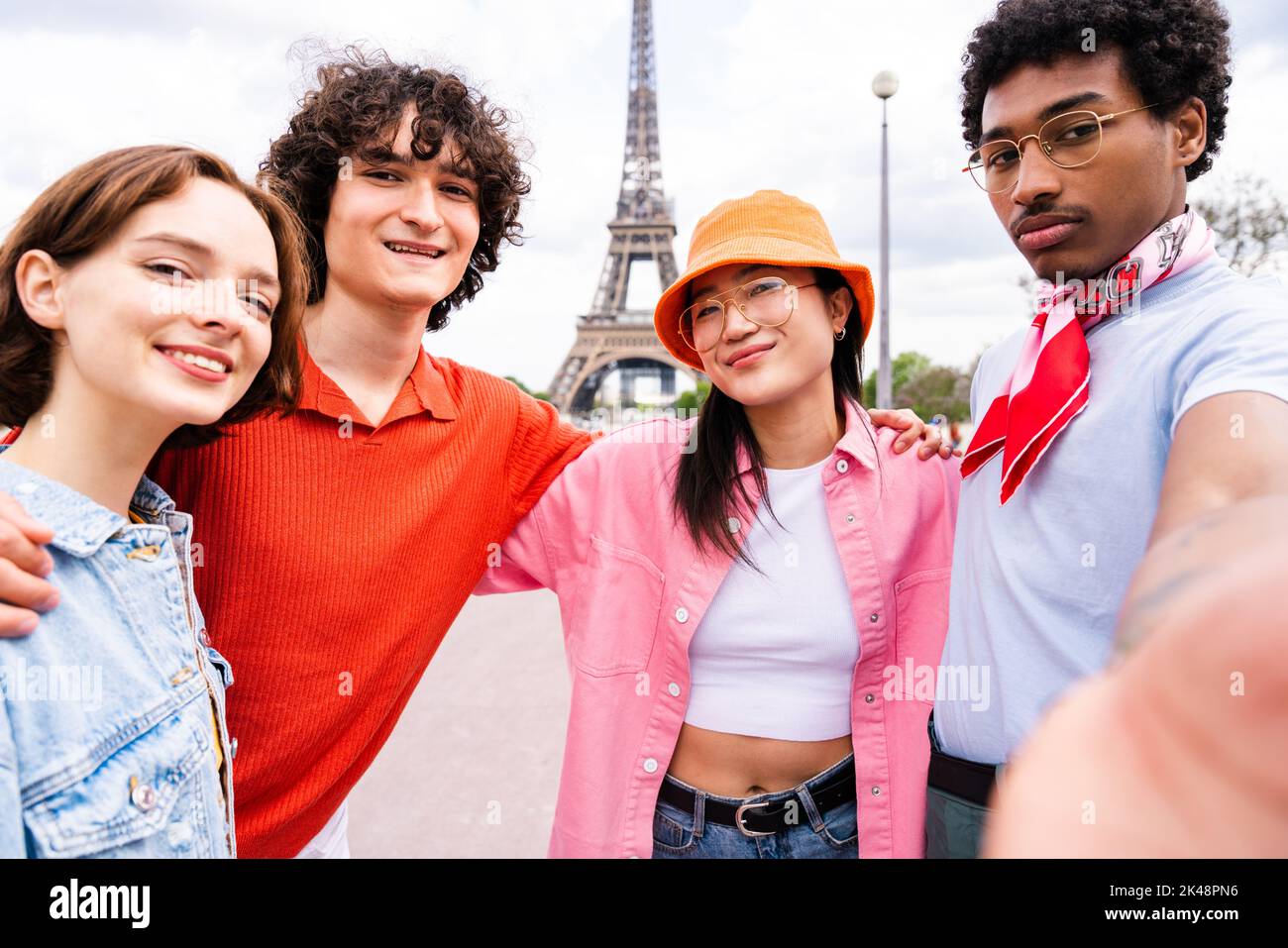 Group of young happy friends visiting Paris and Eiffel Tower, Trocadero ...