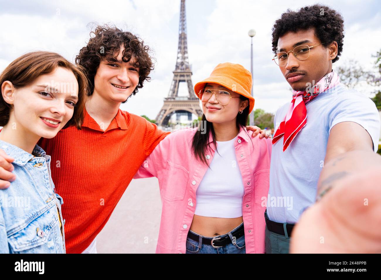 Group of young happy friends visiting Paris and Eiffel Tower, Trocadero ...