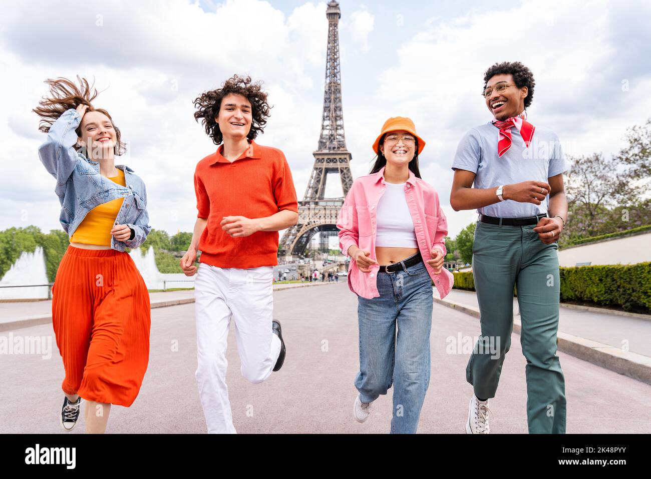 Group of young happy friends visiting Paris and Eiffel Tower, Trocadero ...